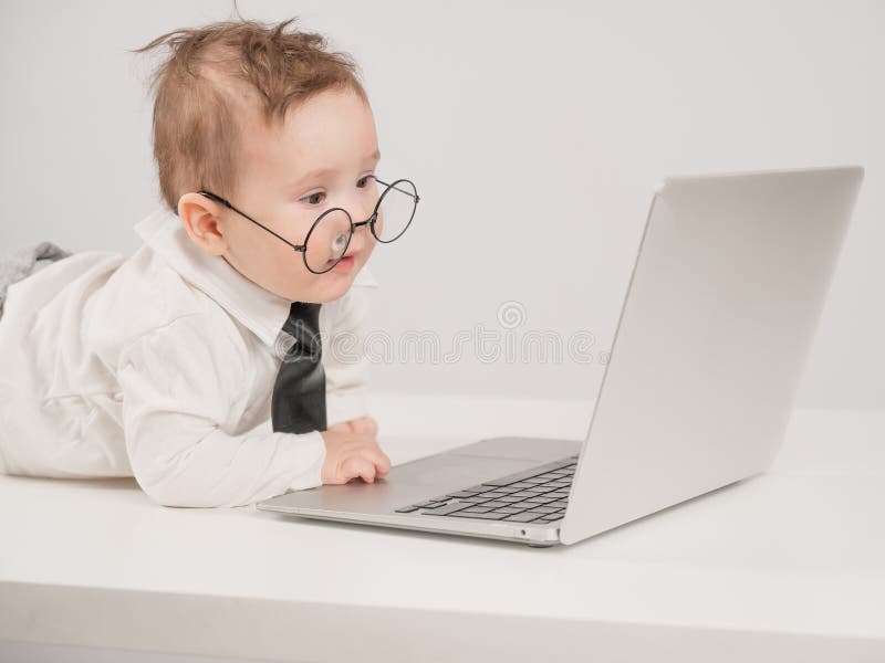 Cute Baby in Glasses and Suit Working on Laptop. Stock Image - Image of ...