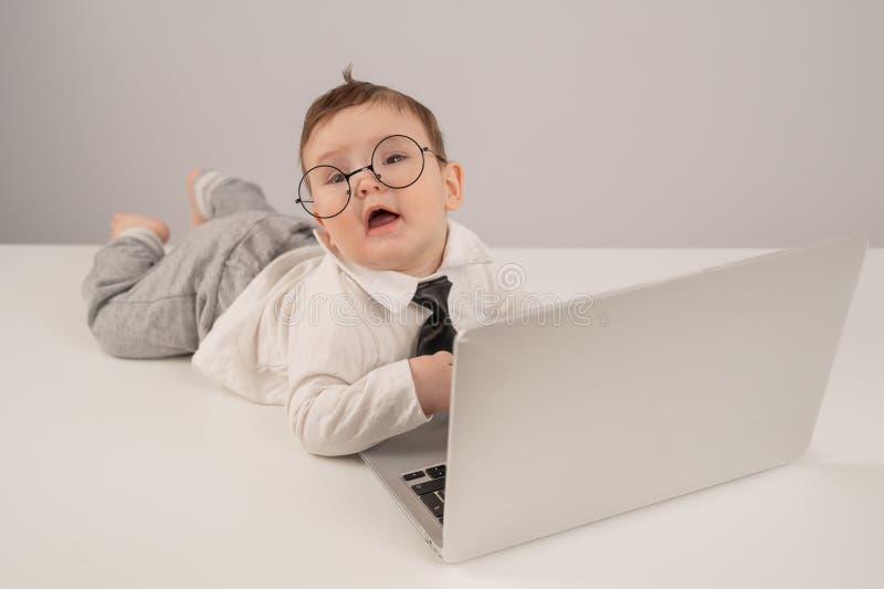 Cute Baby in Glasses and Suit Working on Laptop. Stock Image - Image of ...