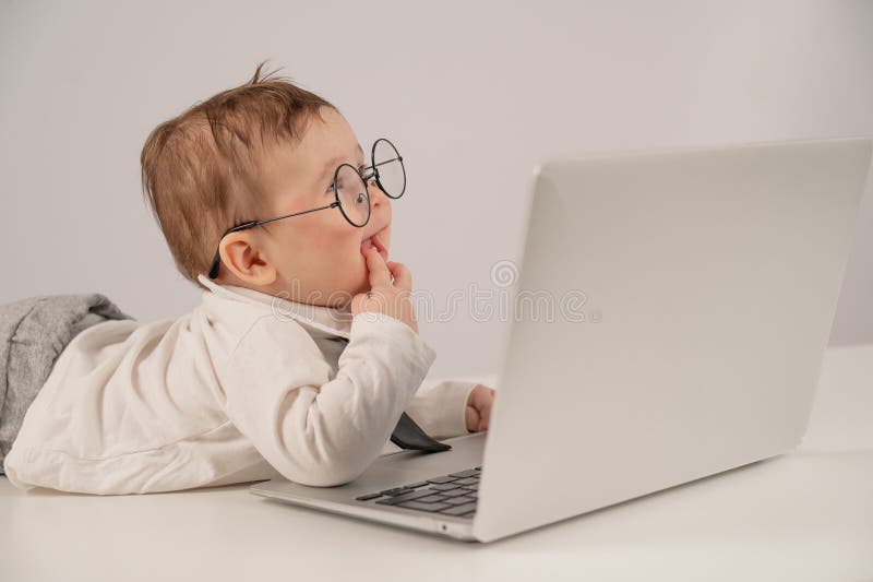Cute Baby in Glasses and Suit Working on Laptop. Stock Image - Image of ...