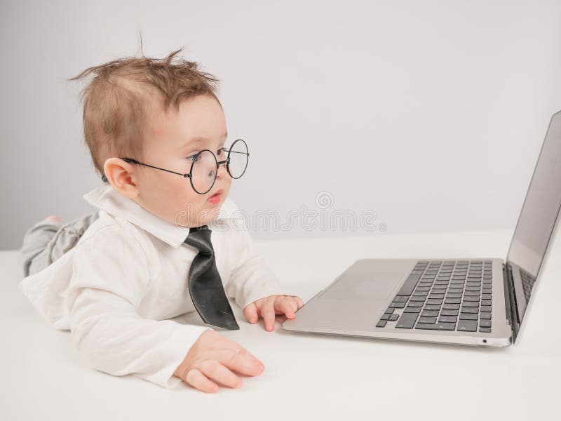 Cute Baby in Glasses and Suit Working on Laptop. Stock Image - Image of ...