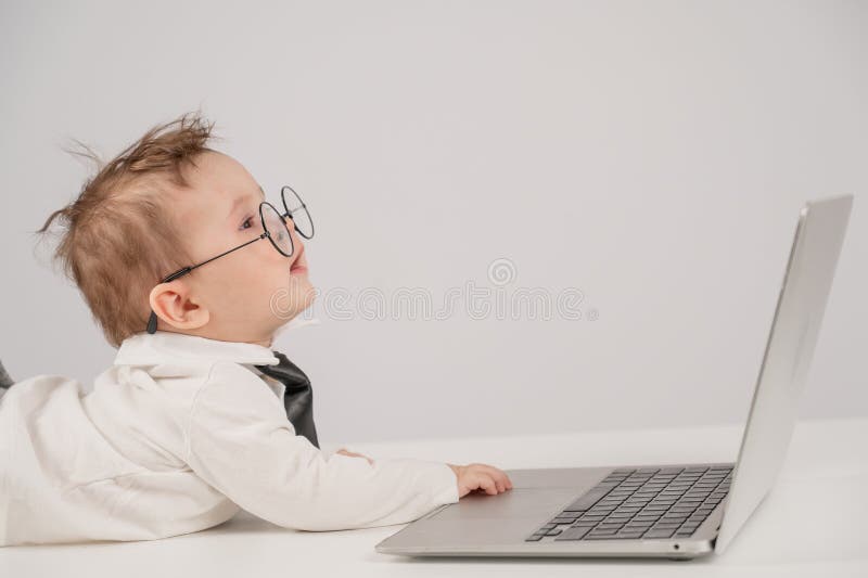 Cute Baby in Glasses and Suit Working on Laptop. Stock Image - Image of ...