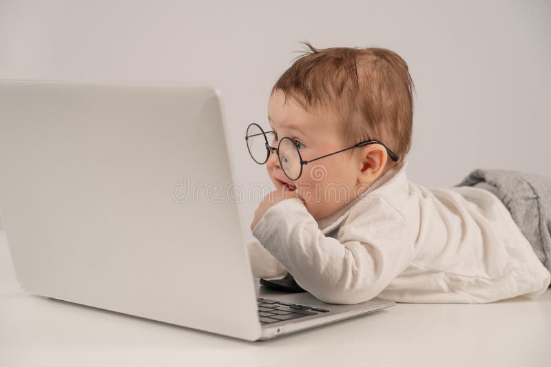 Cute Baby in Glasses and Suit Working on Laptop. Stock Image - Image of ...