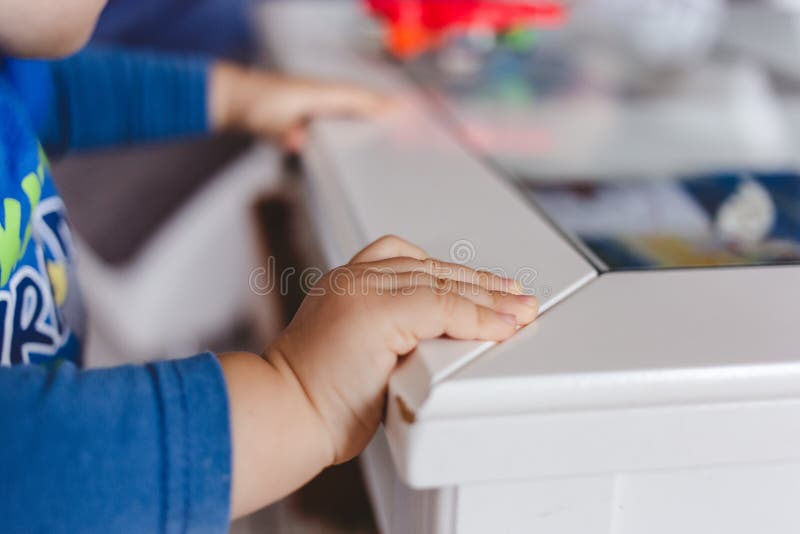 Cute Baby with Hands on a White Table Stock Photo - Image of innocence ...