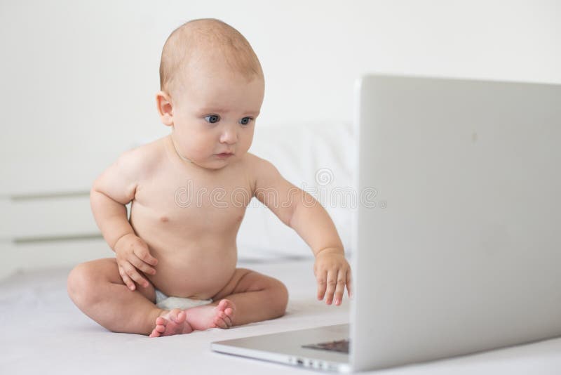 Cute Baby with Laptop on the White Bed Stock Photo - Image of baby ...