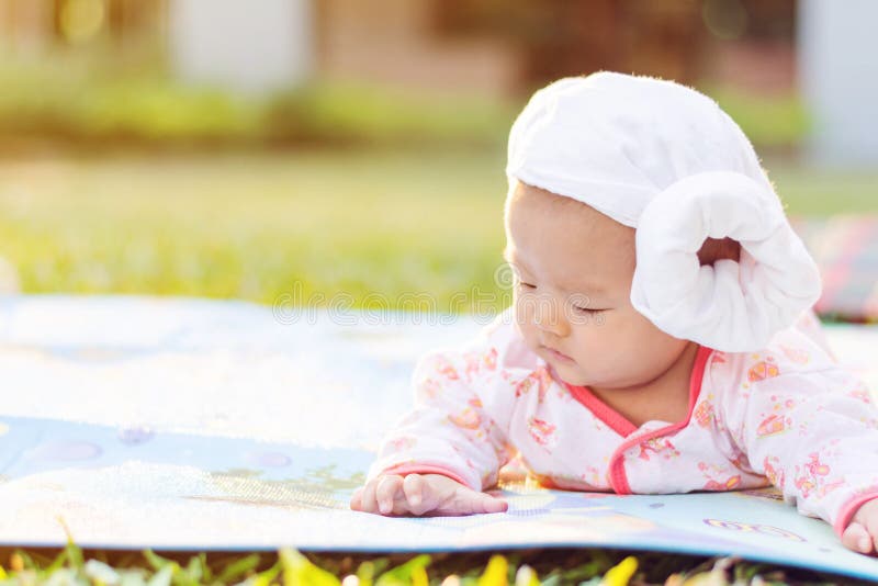 Cute Baby Lie Prone on Ground at Park Stock Image - Image of asian ...