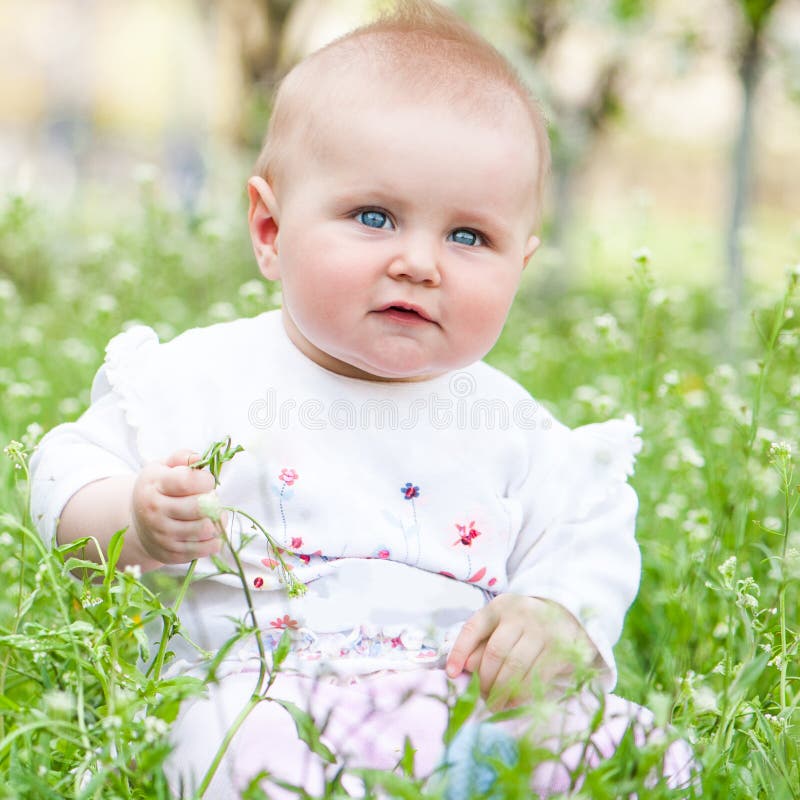 Cute baby on the meadow stock image. Image of happiness - 31164883
