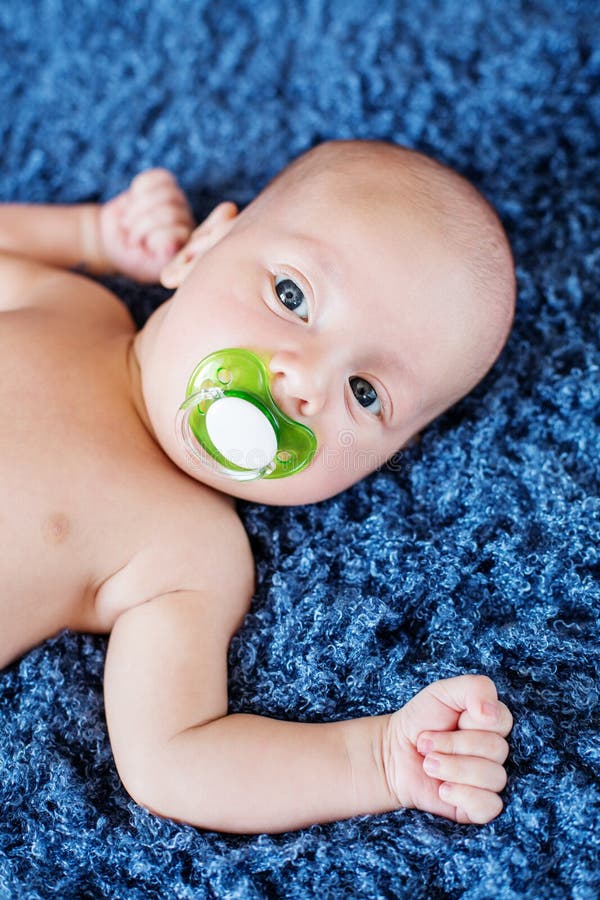 Baby Girl in Diaper Lying with Pacifier on Blanket Stock Photo - Image ...