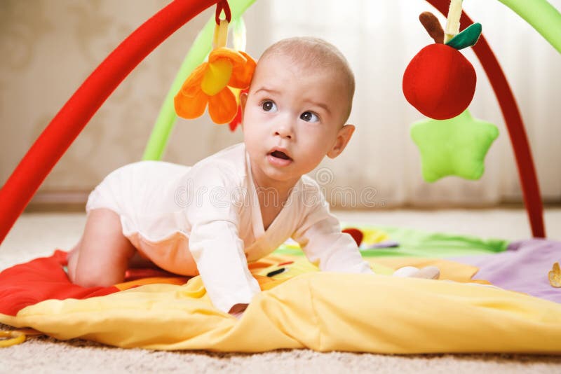 Cute Baby is Playing on the Activity Mat Stock Photo - Image of curious ...