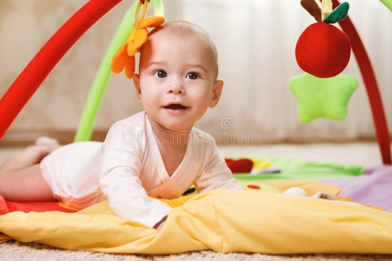 Cute Baby is Playing on the Activity Mat Stock Photo - Image of small ...