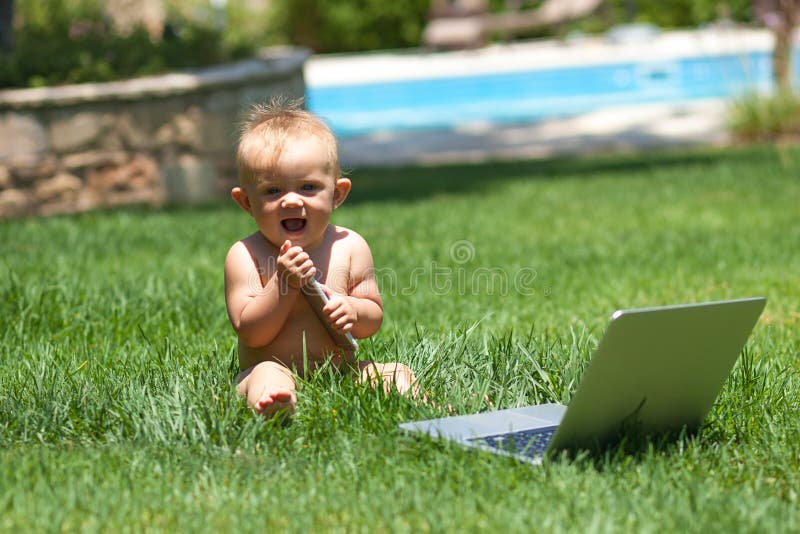 Cute Baby Playing with Laptop Outdoors on Green Grass Stock Photo ...