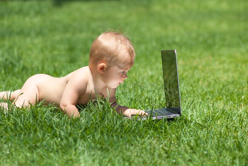 Cute Baby Playing with Laptop Outdoors on Green Grass Stock Photo ...