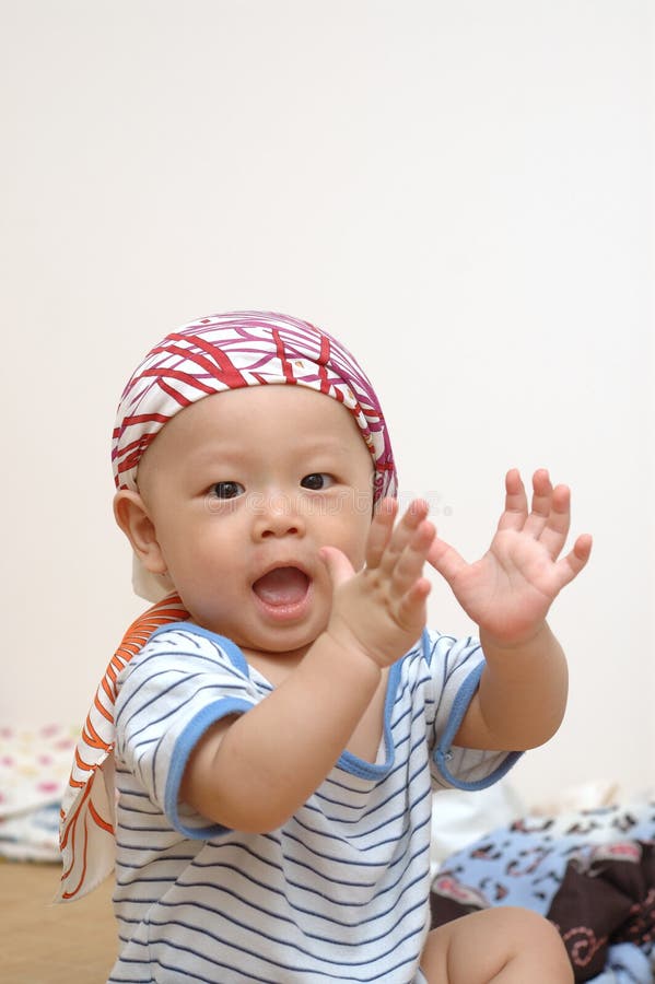 Cute baby portrait stock image. Image of asian, hands - 10493483