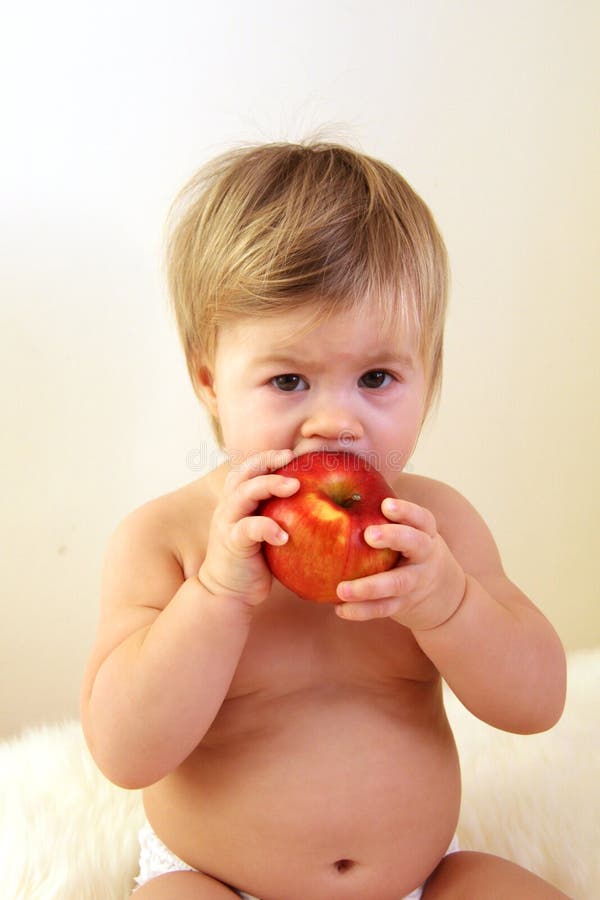 Cute baby with red apple stock photo. Image of measure - 12712682
