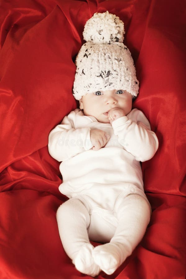Cute baby on red backround stock image. Image of development - 34385027