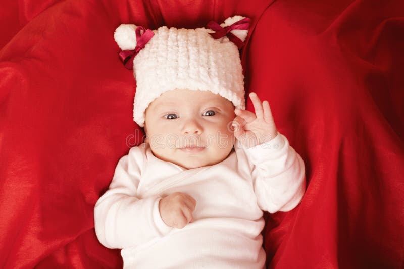 Cute baby on red backround stock photo. Image of nice - 34385050