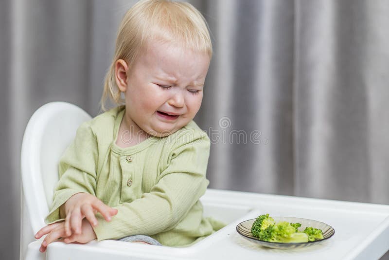 Cute Baby Refuses Eat Broccoli Kitchen Table Stock Photos - Free ...