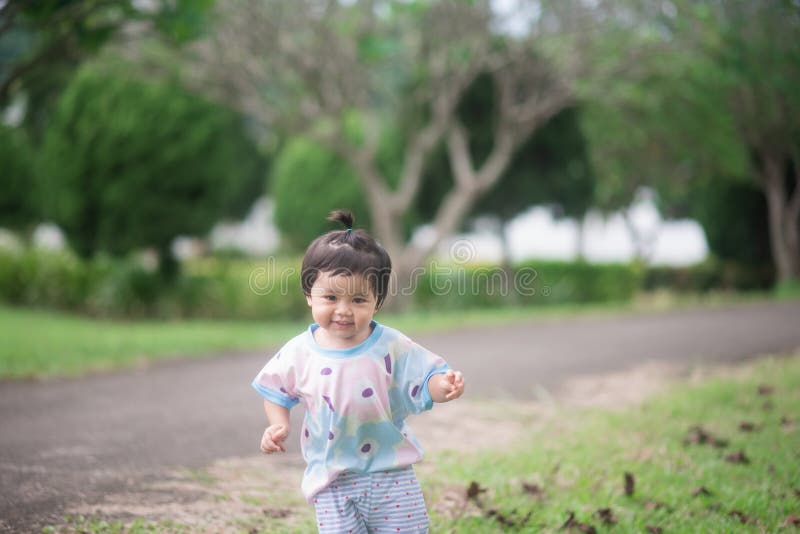 Cute Baby Running in the Garden Stock Image - Image of outdoor ...