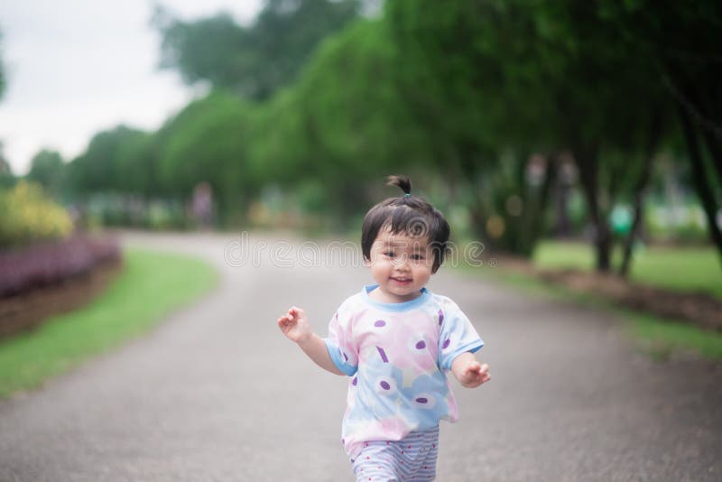 Cute Baby Running in the Garden Stock Image - Image of girl, beautiful ...