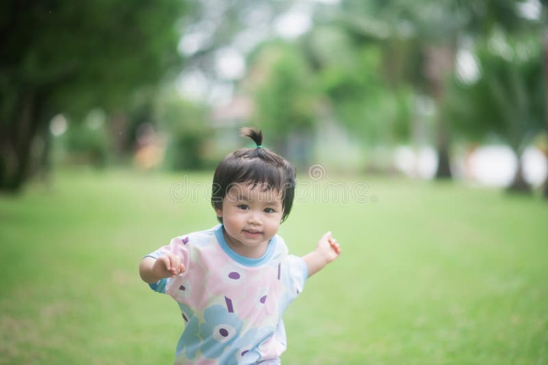 Cute Baby Running in the Garden Stock Photo - Image of adorable, asian ...