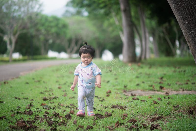 Cute Baby Running in the Garden Stock Photo - Image of caucasian ...