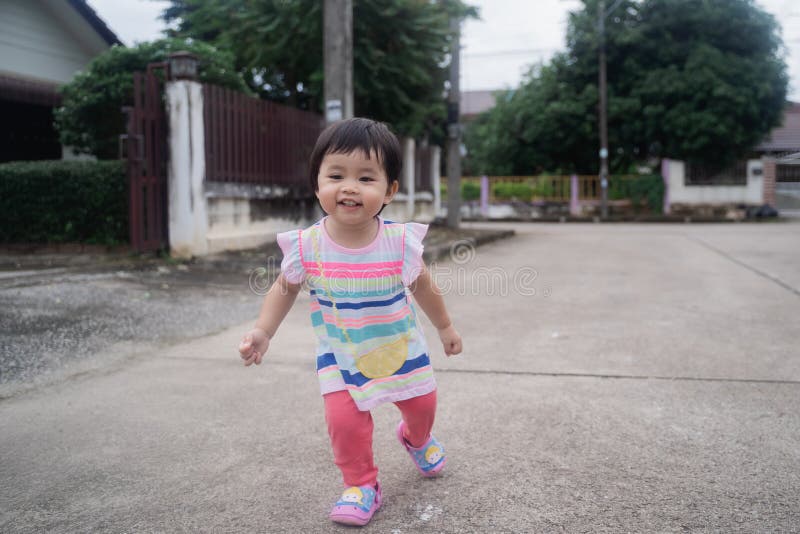 Cute Baby Running on the Road Stock Image - Image of baby, expression ...