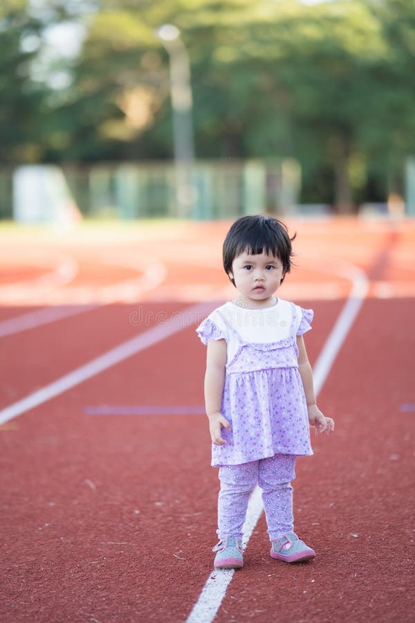 Cute Baby Running at Sport Stadium Stock Photo - Image of family, field ...
