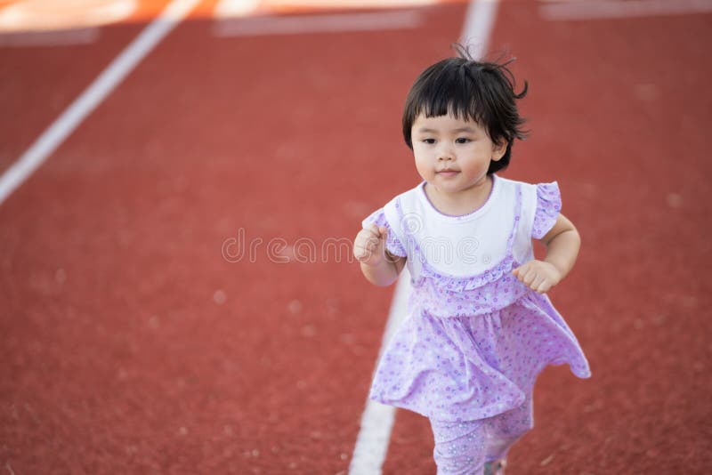 Cute Baby Running at Sport Stadium Stock Photo - Image of lifestyle ...