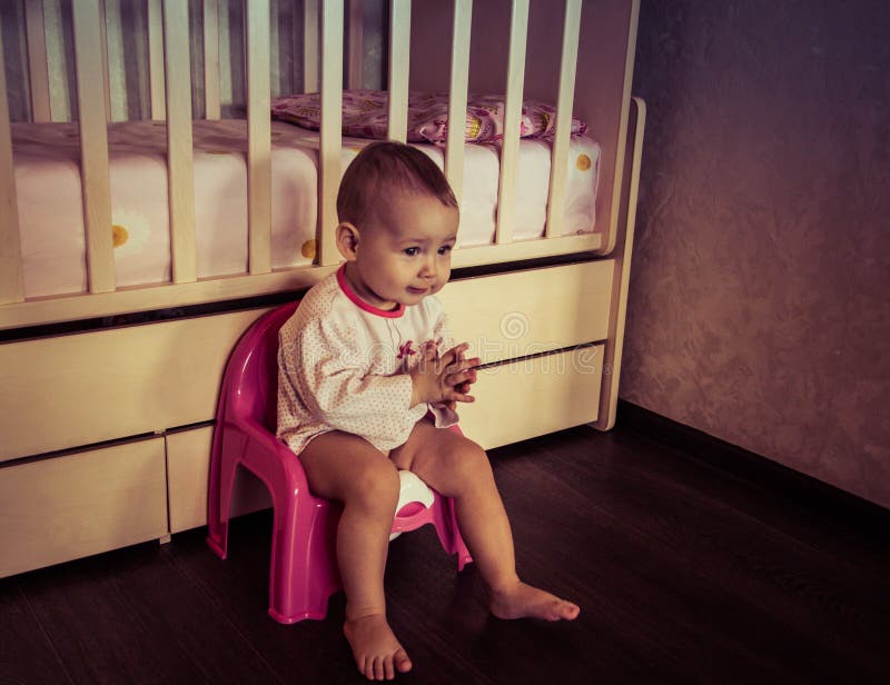 Cute baby sitting on a pot stock photo. Image of sanitary - 87563532
