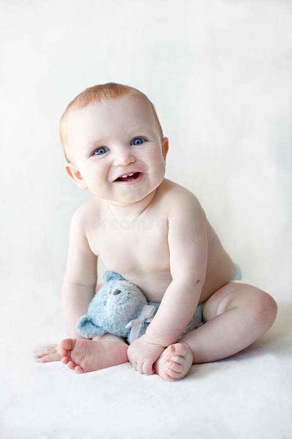 Baby sitting on the floor stock image. Image of happy - 15219423