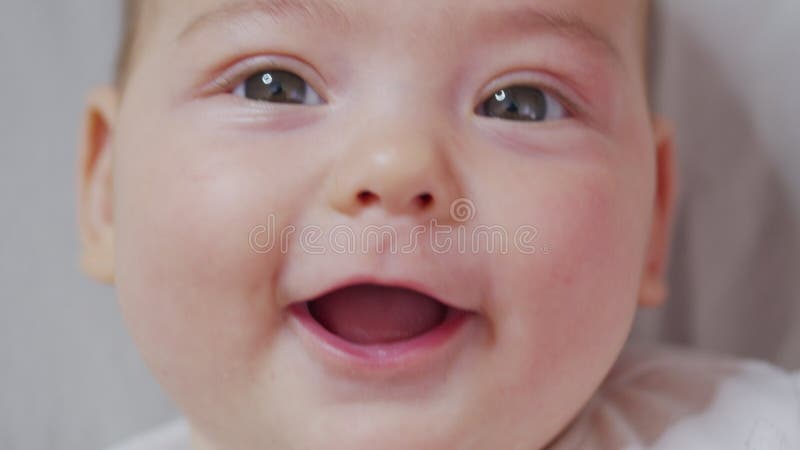 Cute Baby Smiling and Looking in the Camera Close Up. Stock Video ...