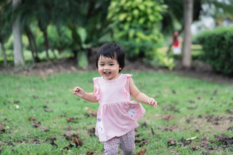 Cute Baby Smiling and Running at the Park Stock Image - Image of ...