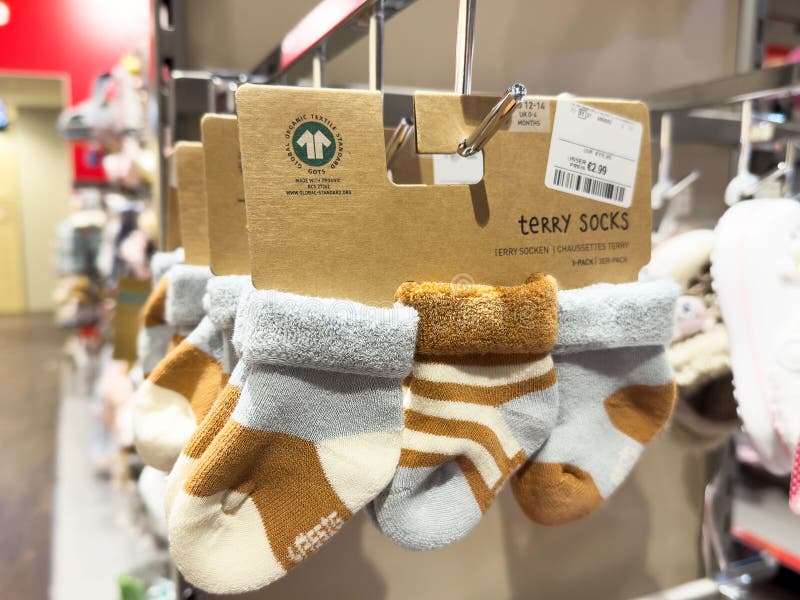 Cute Baby Socks Display on Store Rack with Beige and Blue Patterns ...