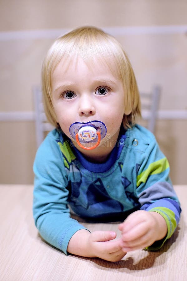 Cute baby at the table stock image. Image of childhood - 107414811