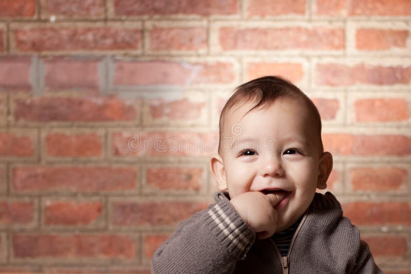 Cute Baby Thinking on a Bricks Background Stock Photo - Image of face ...