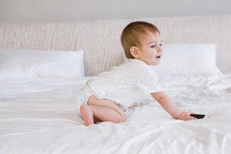 Cute baby using smartphone stock photo. Image of homey - 66094244