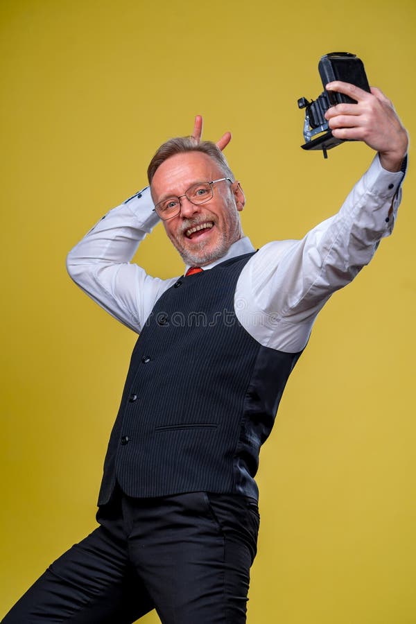A Cute Bearded Man With Glasses Built Funny Face And Looks Into The