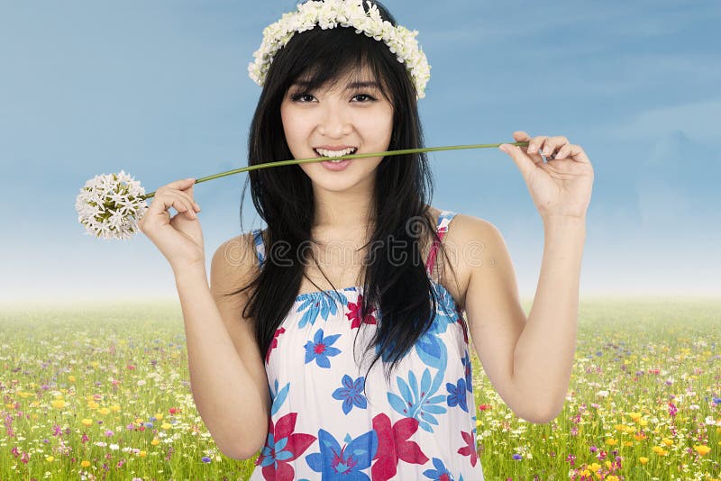 Cute Beautiful Woman Biting Flower Stock Image - Image of flower, model ...