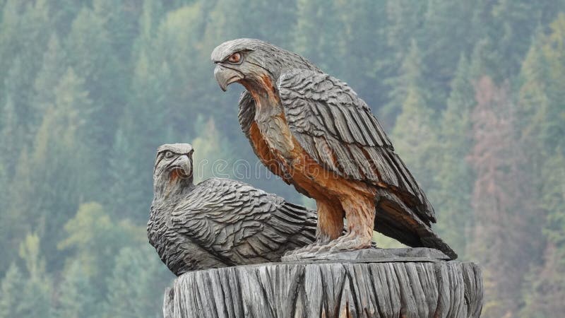 Eagle Statue Perching on Wooden Stock Photo - Image of colours, water ...
