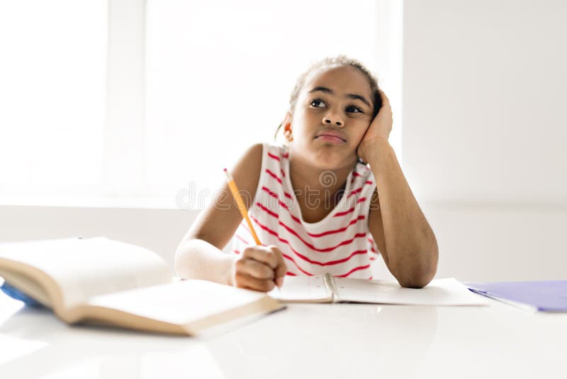 A Cute Black Girl Doing Homework at Home Stock Image - Image of black ...