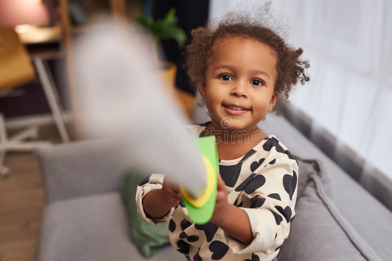 Cute Black Girl Pointing Toy Sword at Camera and Playing Stock Photo ...