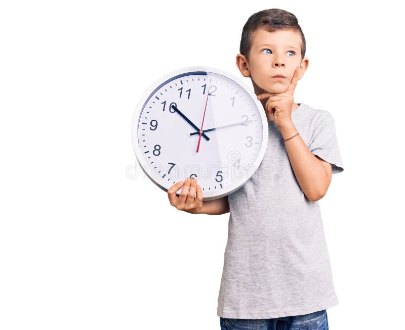 Cute Blond Kid Holding Big Clock Serious Face Thinking about Question ...