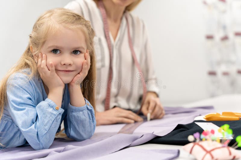 Cute Blonde Child Cutting Out a New Model in a Design Studio Stock ...