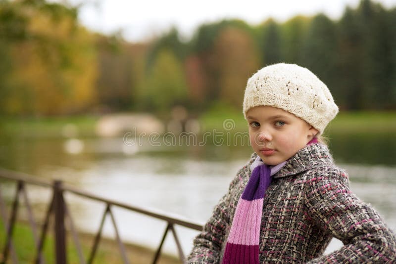 Cute Blonde Girl Looking Backwards Stock Photo - Image of jacket, beret ...