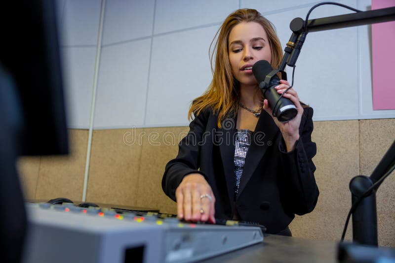 Cute Blonde Girl with Microphone at the Radio Studio Stock Image ...