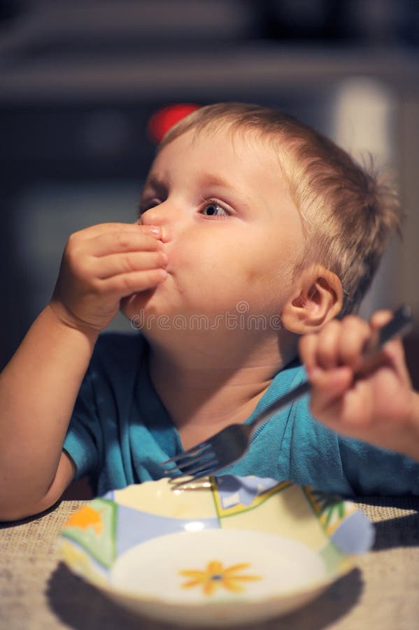 Cute boy stock image. Image of hungry, table, small, face - 18909867