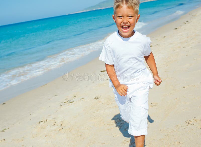 Happy boy on beach stock photo. Image of pinwheel, beach - 11340462