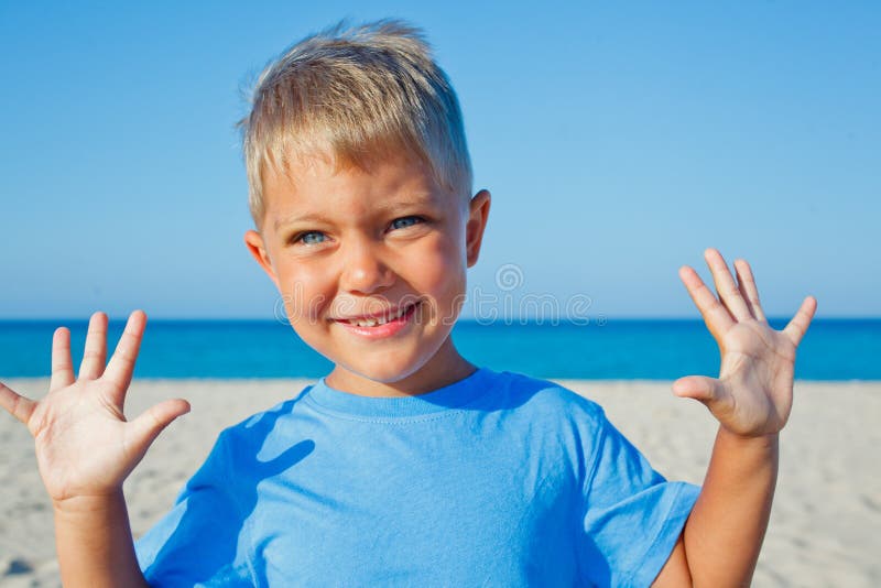 Cute boy on the beach stock photo. Image of coast, activity - 36204818