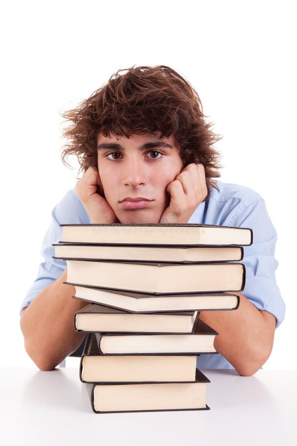 Cute Boy Bored, among Books, on His Desk Stock Image - Image of male ...