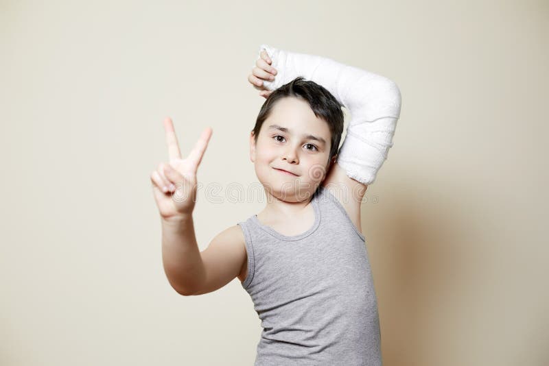 Cute boy with broken arm stock photo. Image of healthy - 70909178