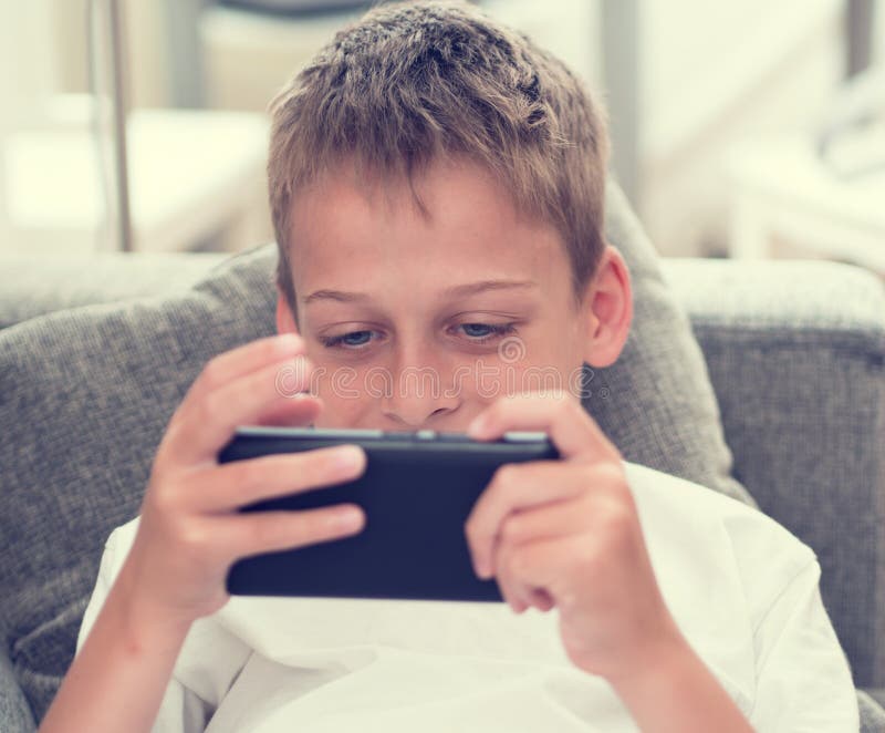 Cute boy with cell phone stock image. Image of model - 124877447